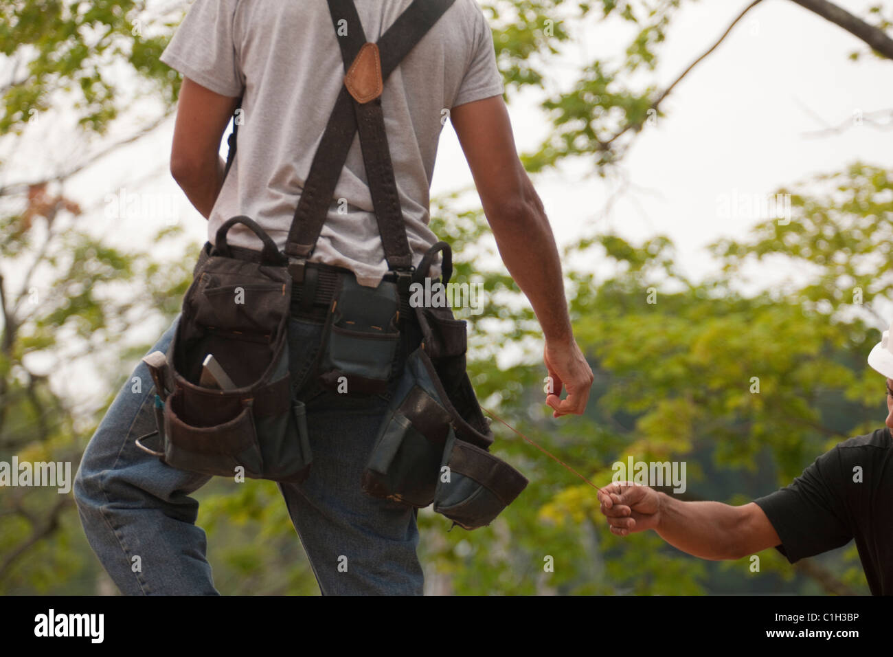 Hispanic carpenters working at a construction site Stock Photo - Alamy