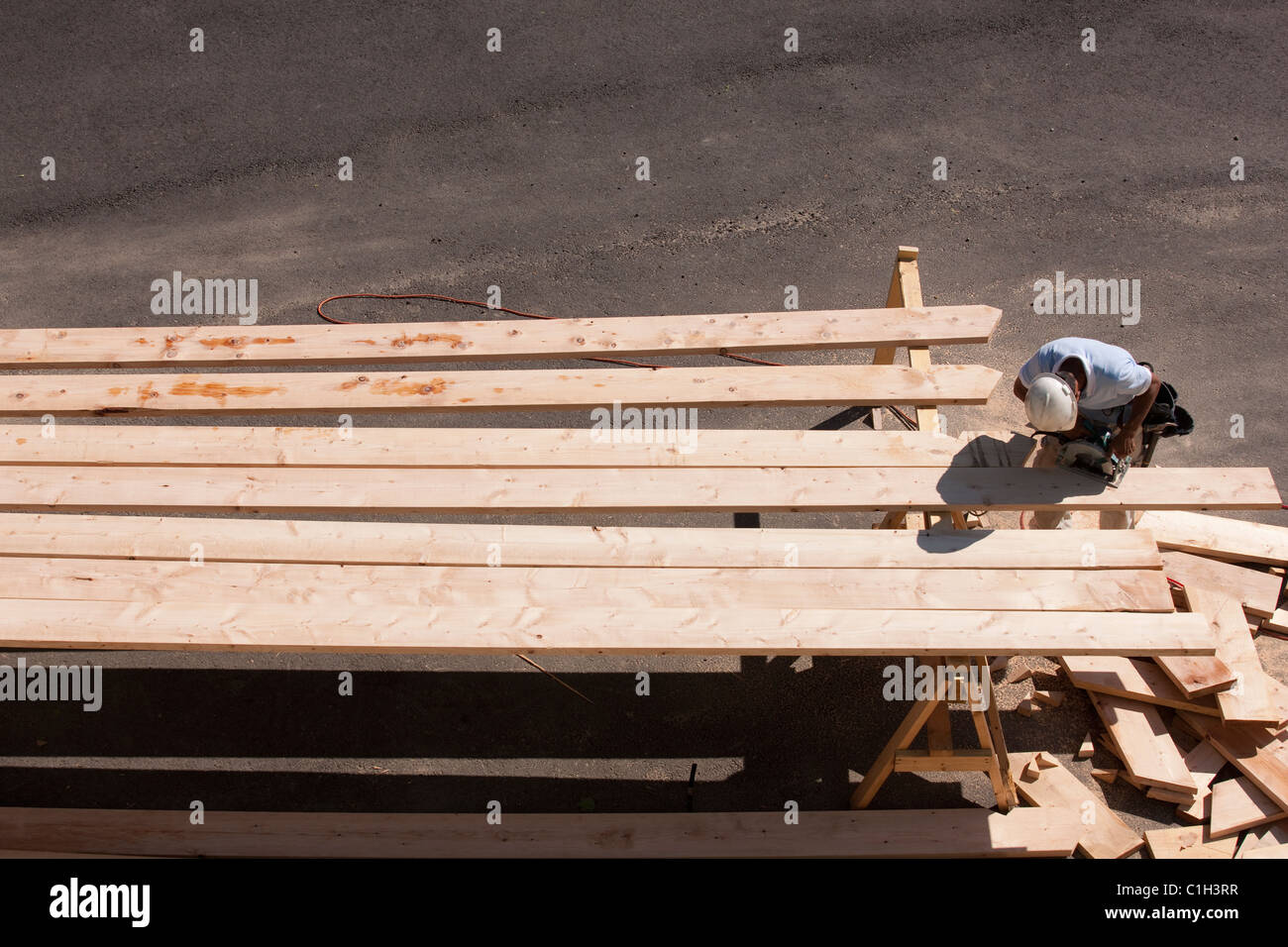 High angle view of a carpenter cutting bevels on rafters Stock Photo ...