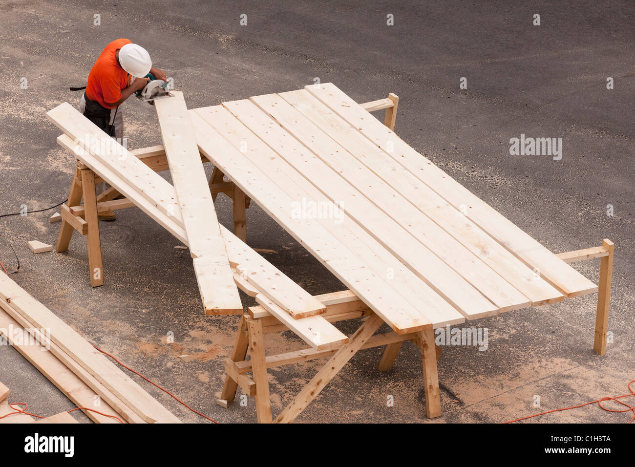 High angle view of a carpenter cutting bevels on rafters Stock Photo ...