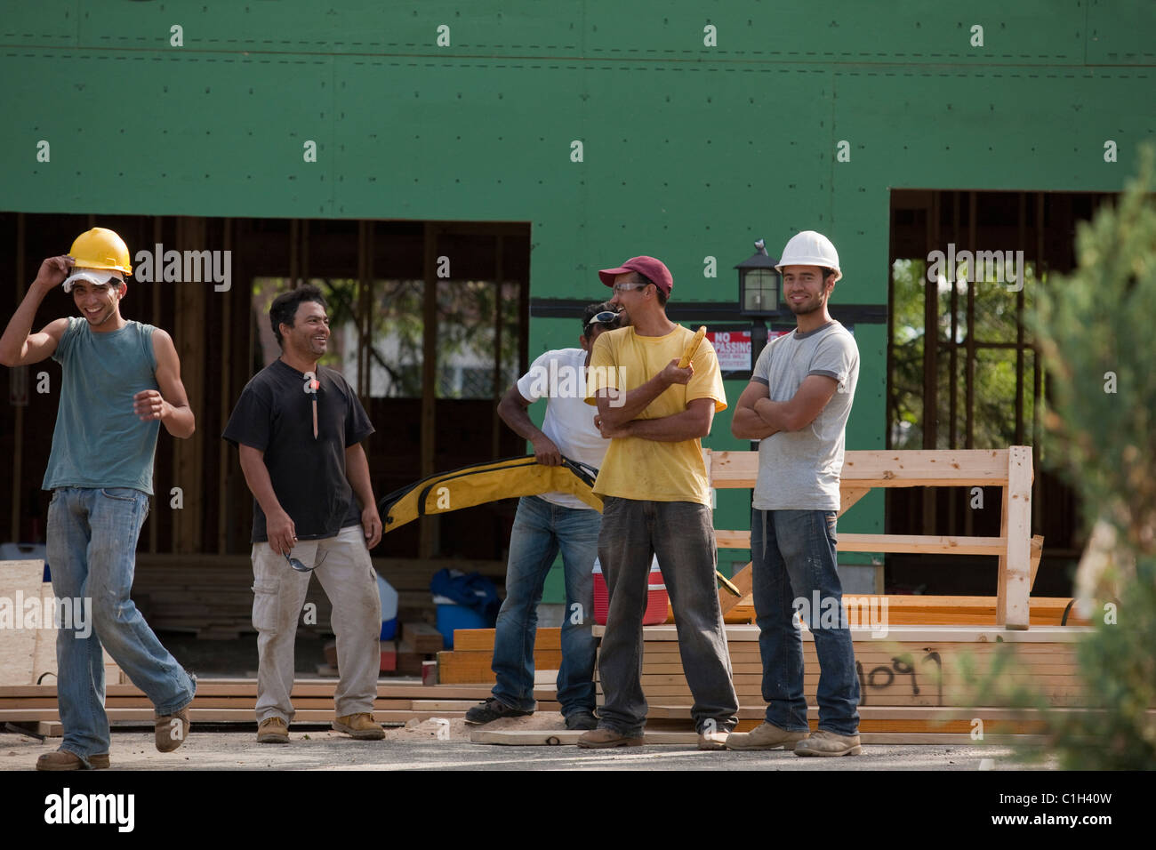Construction workers relaxing at the end of the day after work Stock ...