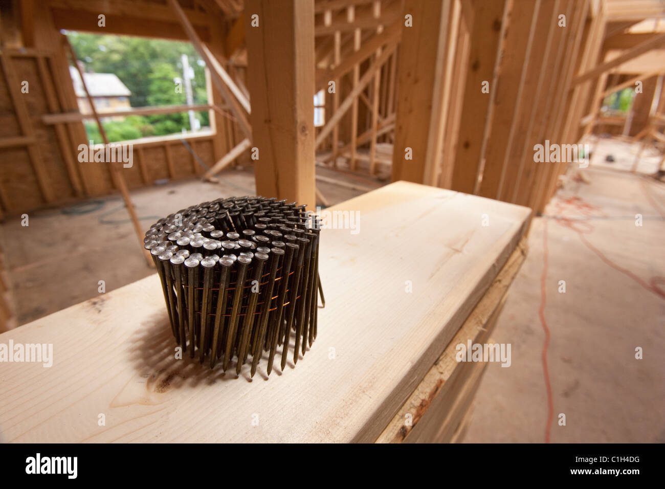 Coil of nails on a board at a construction site Stock Photo - Alamy