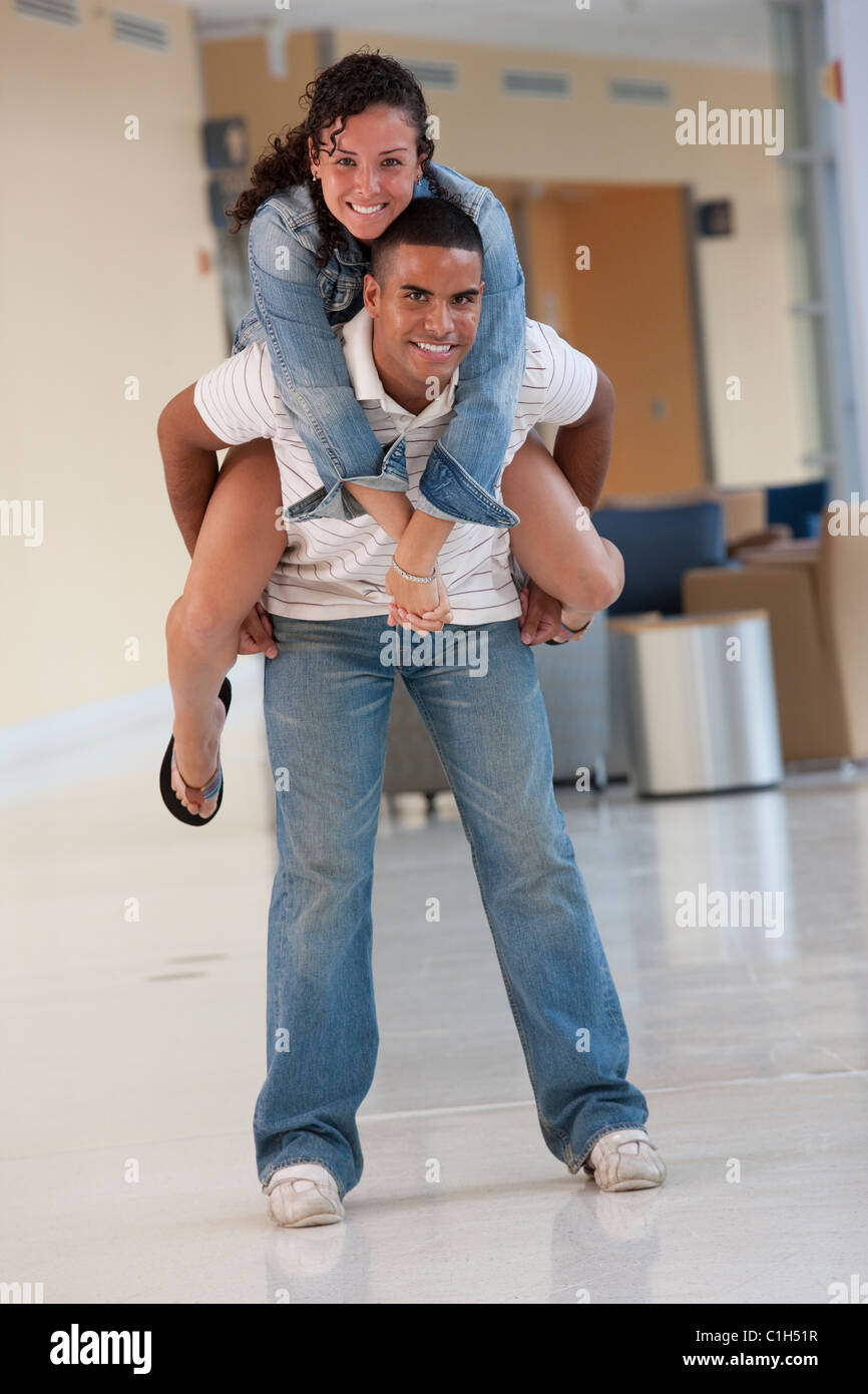 Young Woman Riding Piggyback Friend Stock Photos & Young Woman Riding ...