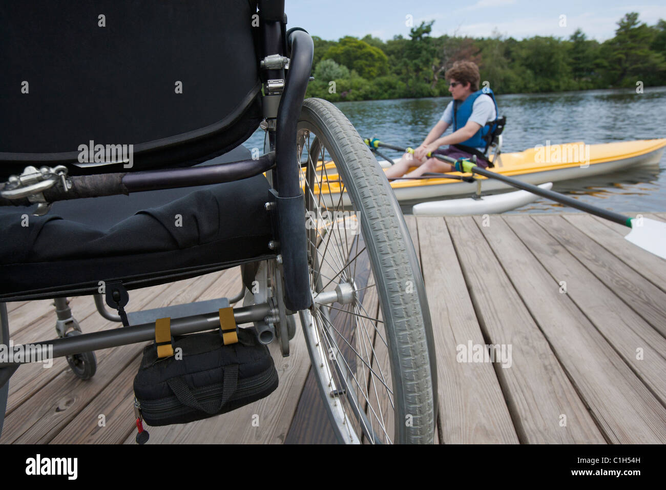 Woman with spinal cord injury preparing for a boat race Stock Photo - Alamy