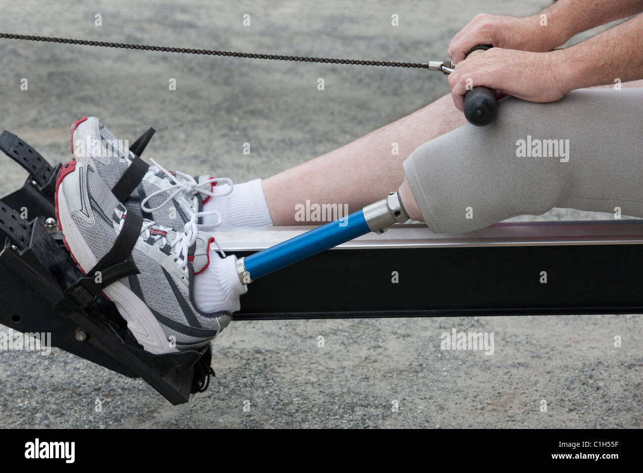 Man with a prosthetic leg exercising on an exercise bike Stock Photo ...