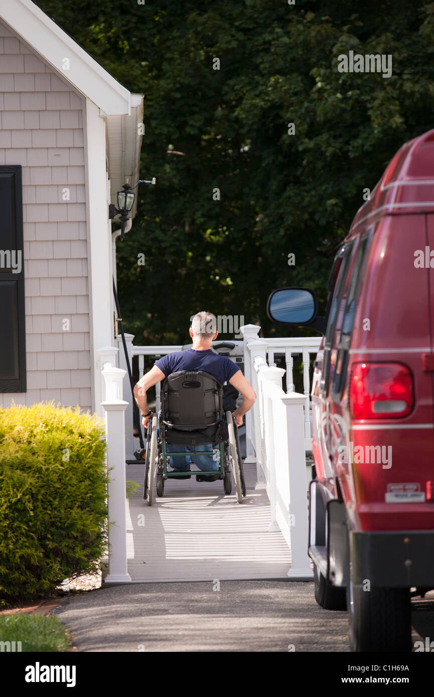 Man in wheelchair going up a ramp hi-res stock photography and images ...