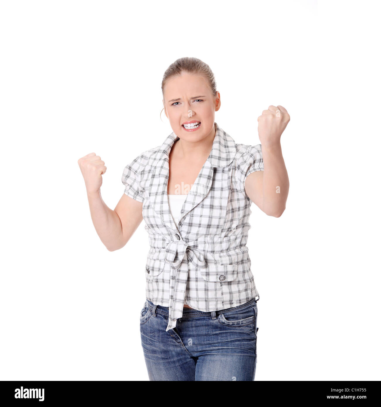 Young angry woman with fist up, isolated Stock Photo - Alamy