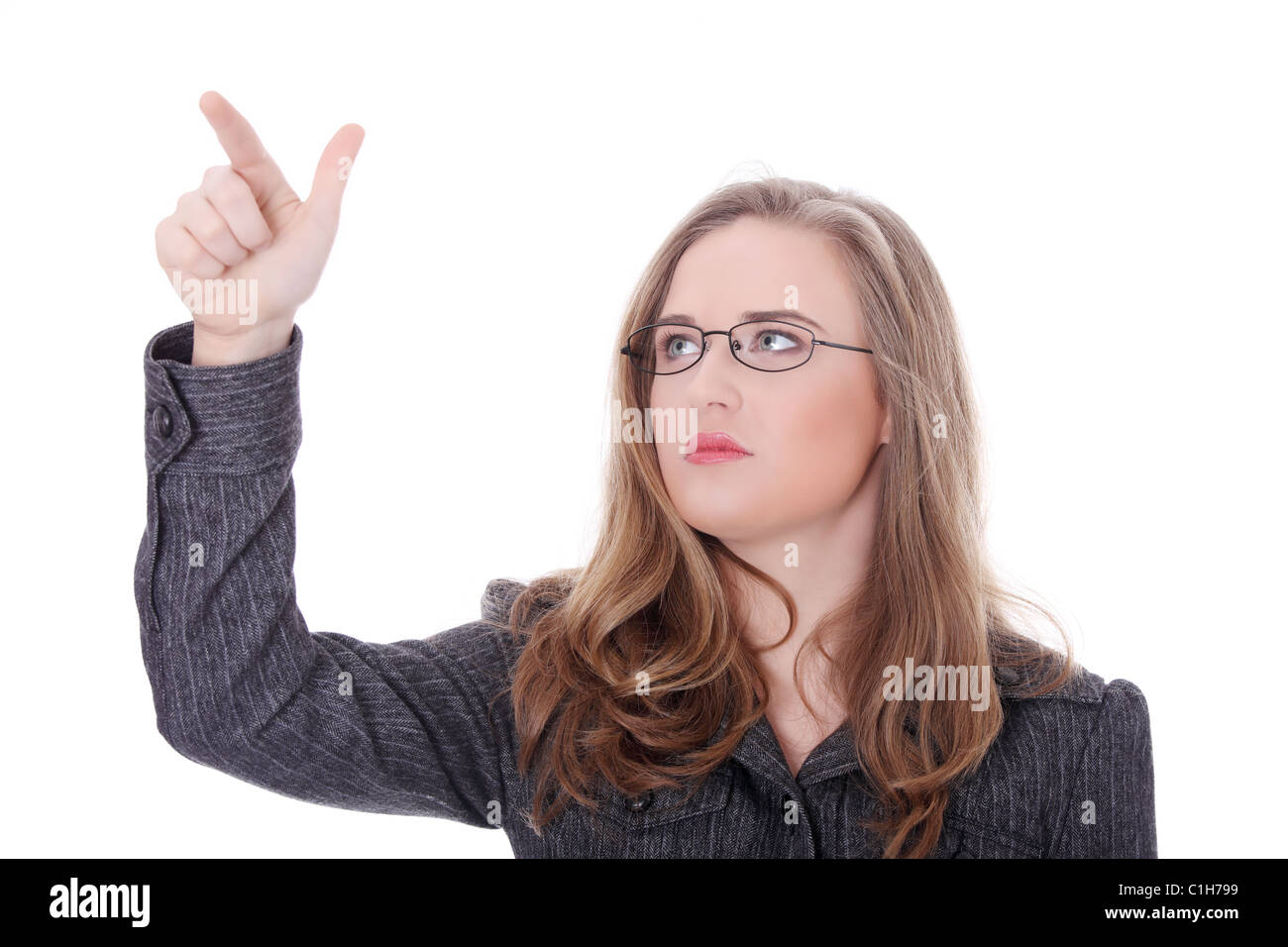 Young beautiful businesswoman pointing something on abstract screen ...