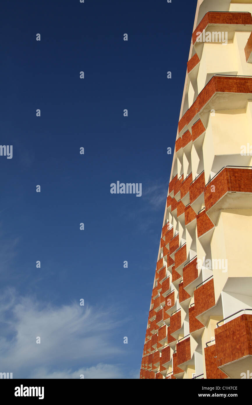 Hotel balconies in bright morning sun Stock Photo - Alamy