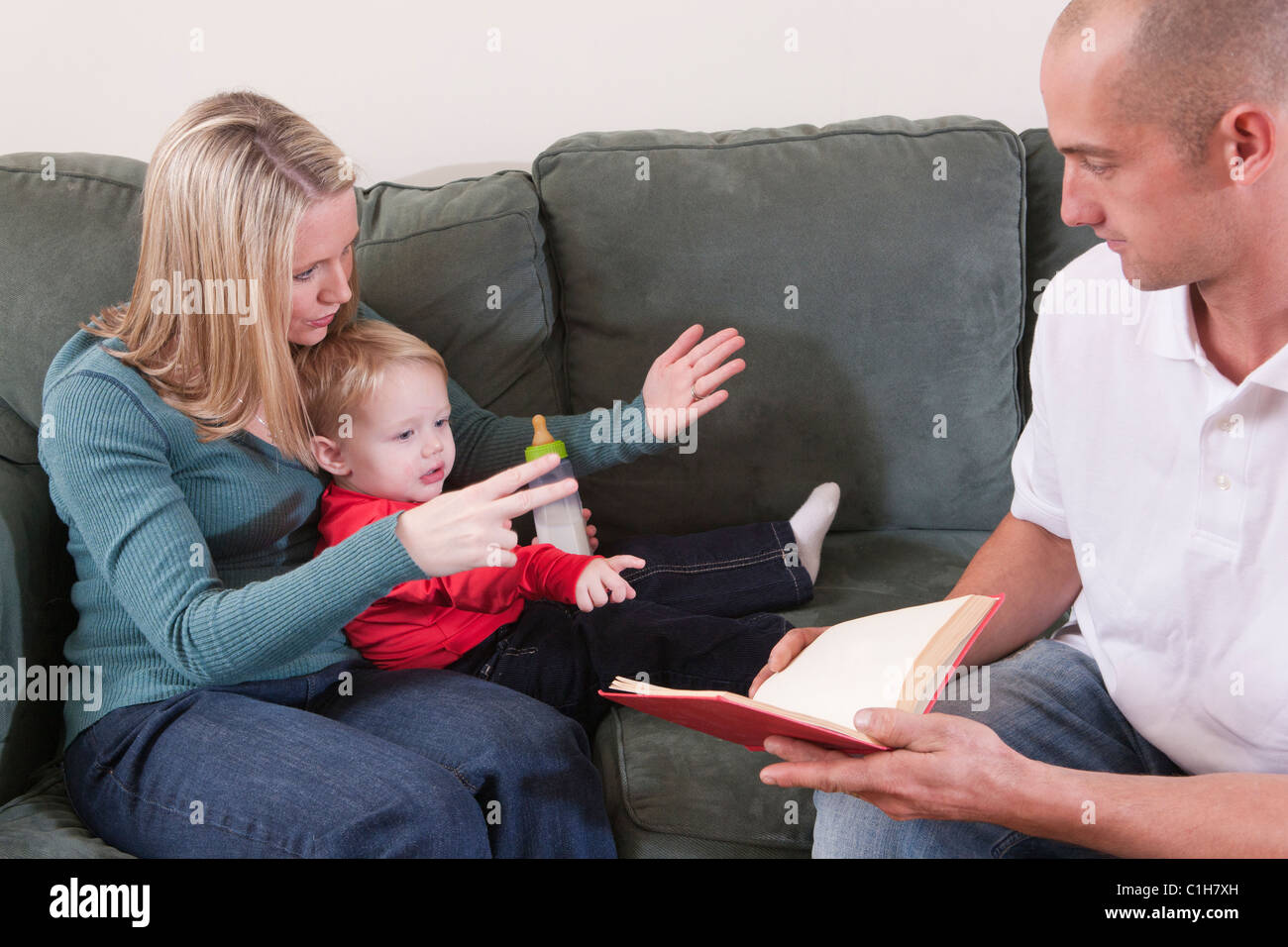 Woman signing the word 'Read' in American Sign Language while teaching ...