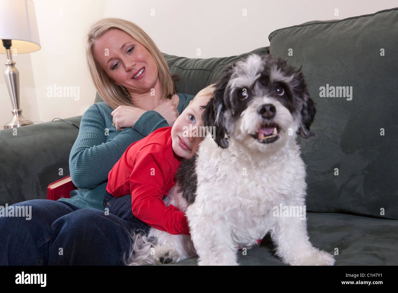 Woman signing the word 'love' in American Sign Language while her son ...