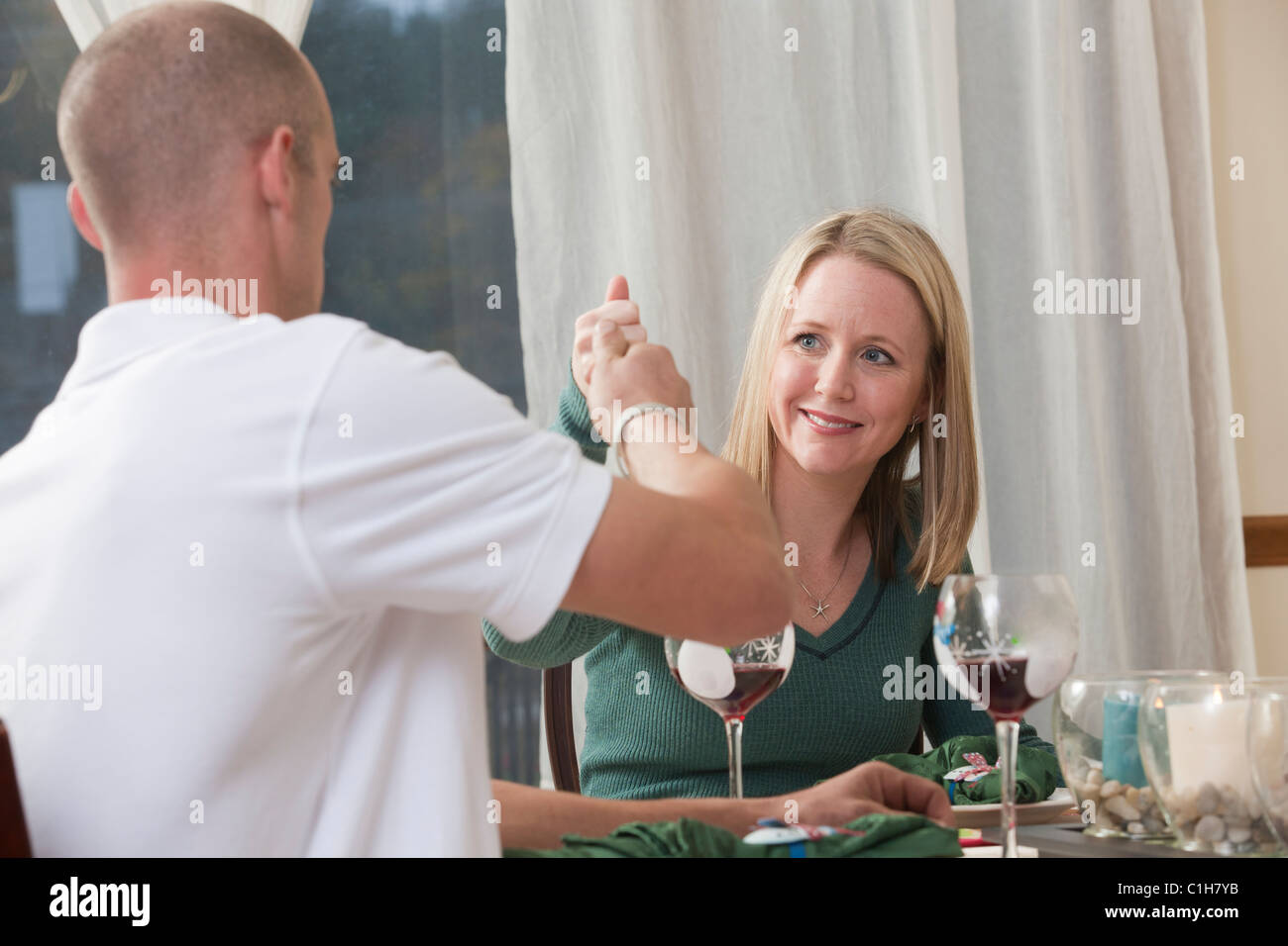Man signing the word 'Cheers' in American Sign Language while ...