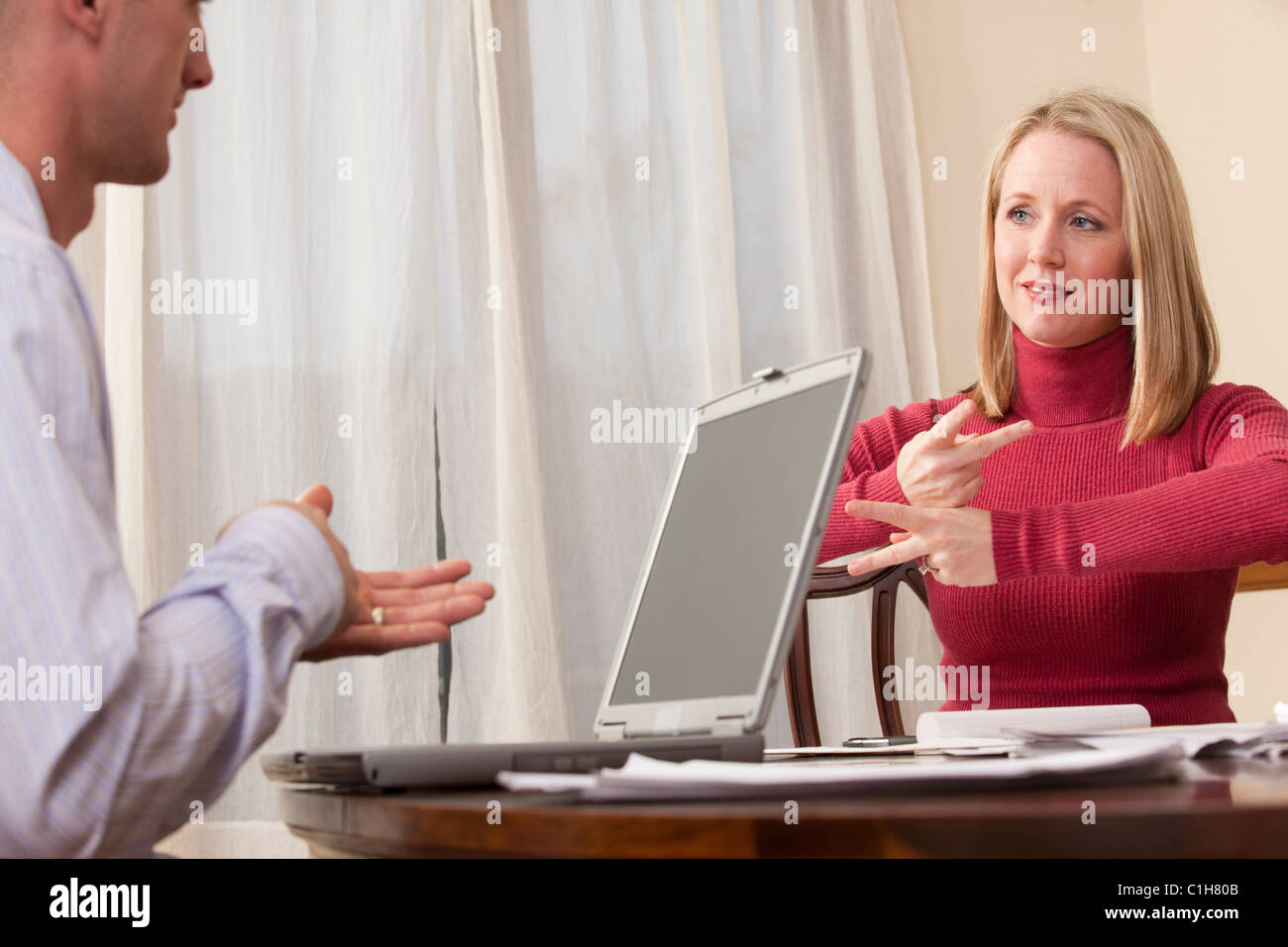 Woman and man signing the phrase 'Daycare pay' in American Sign ...