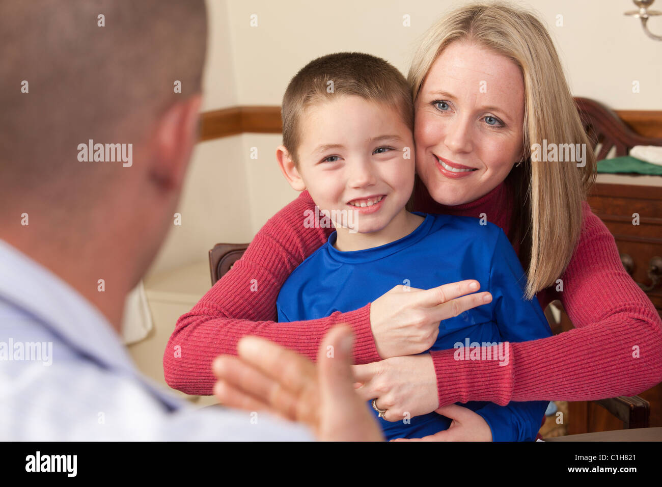 Woman signing the phrase 'Daycare pay' in American Sign Language while ...