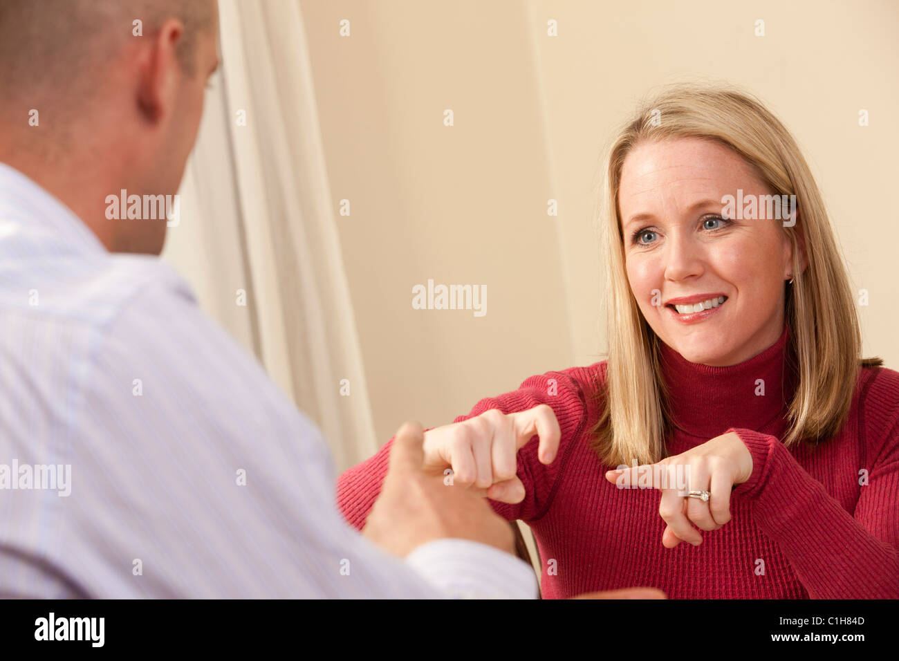 Woman signing the phrase 'TTY' in American Sign Language while ...