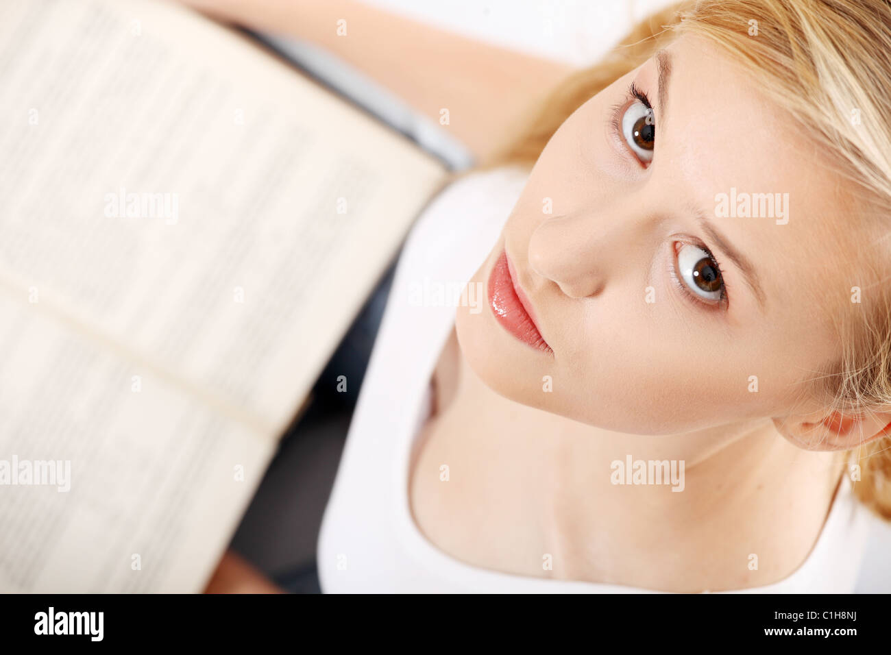 Reading the book. Young happy beautiful girl reads book Stock Photo - Alamy