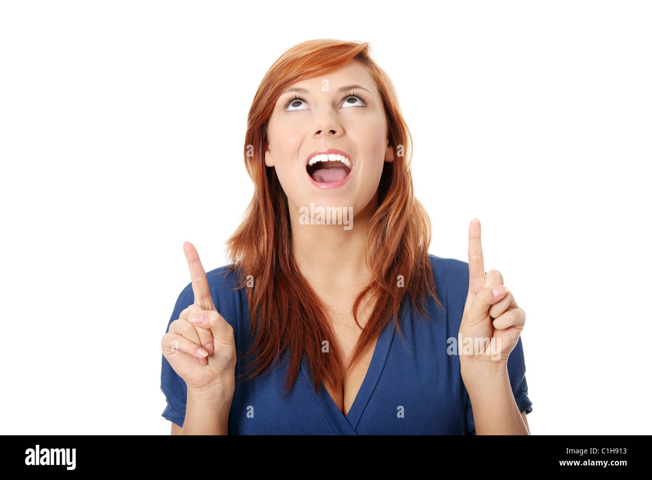 Young beautiful happy caucasian woman pointing up ,isolated on white ...