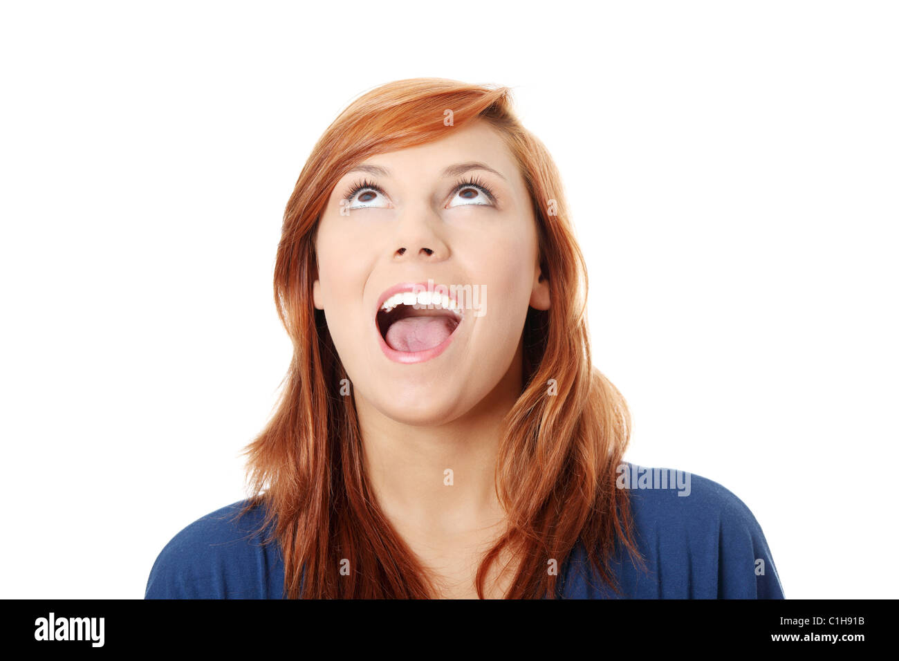 Surprised young woman looking up , isolated on white Stock Photo - Alamy
