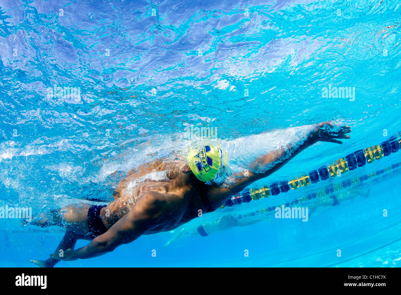 Male swimmers compete in a backstroke event at the annual Orange Bowl ...