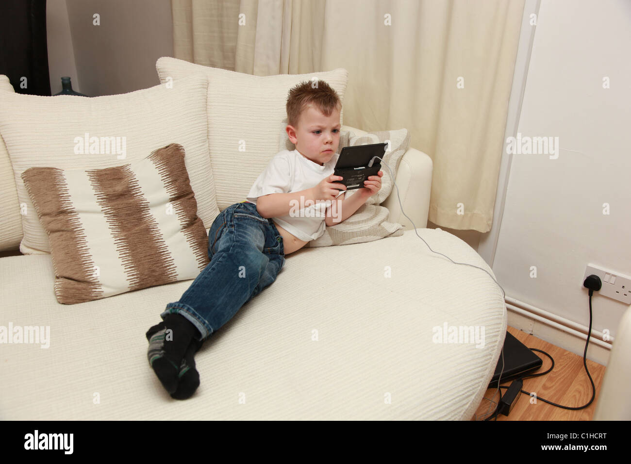 Toddler playing Nintendo DS Stock Photo - Alamy