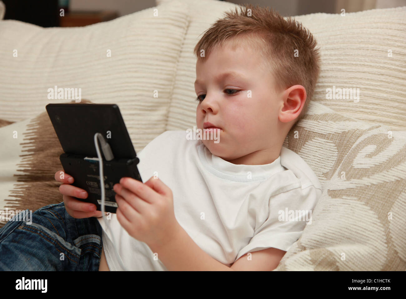 Toddler playing Nintendo DS Stock Photo - Alamy