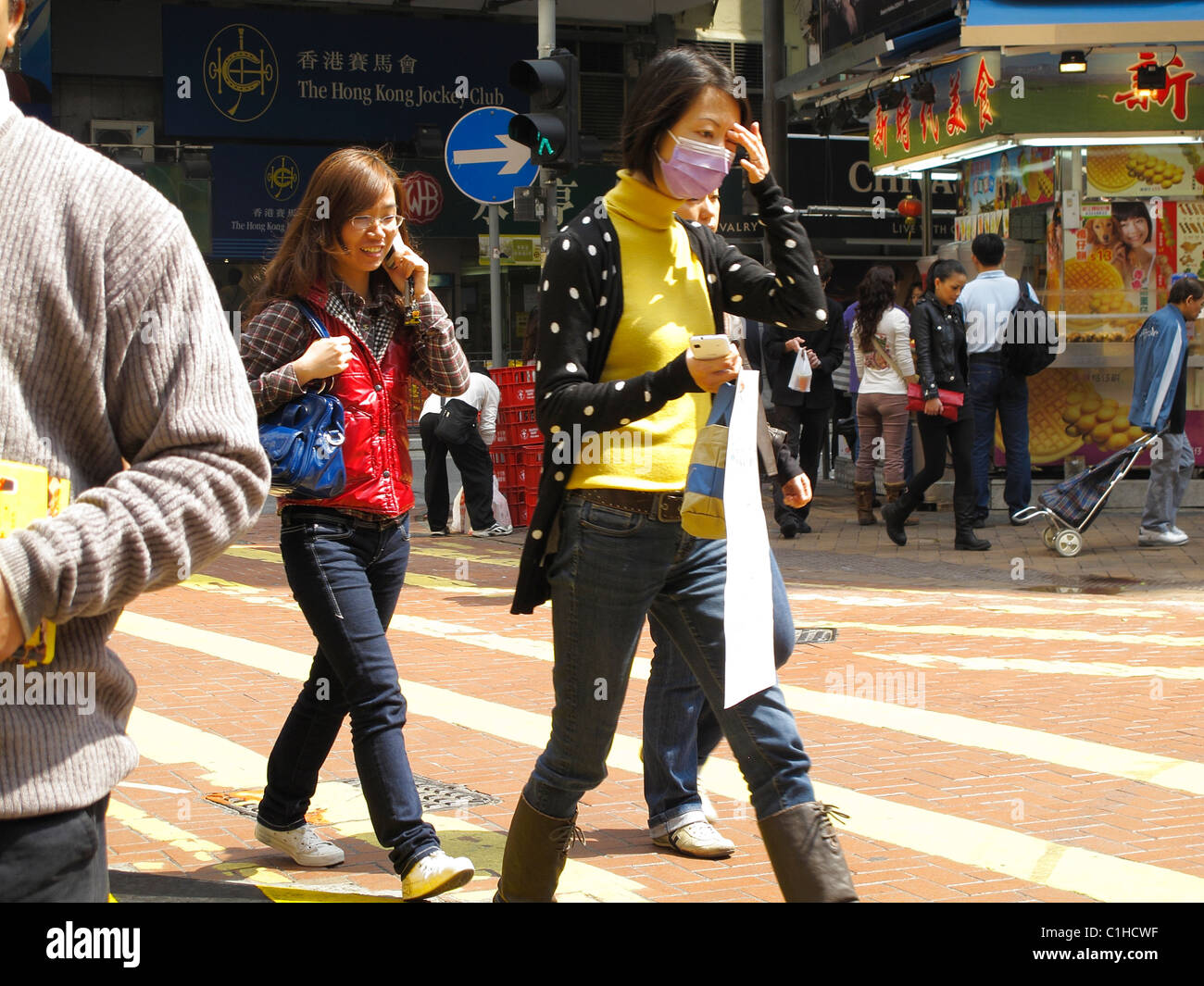 Woman with pink surgical mask on the streets of Hong Kong, China Stock ...