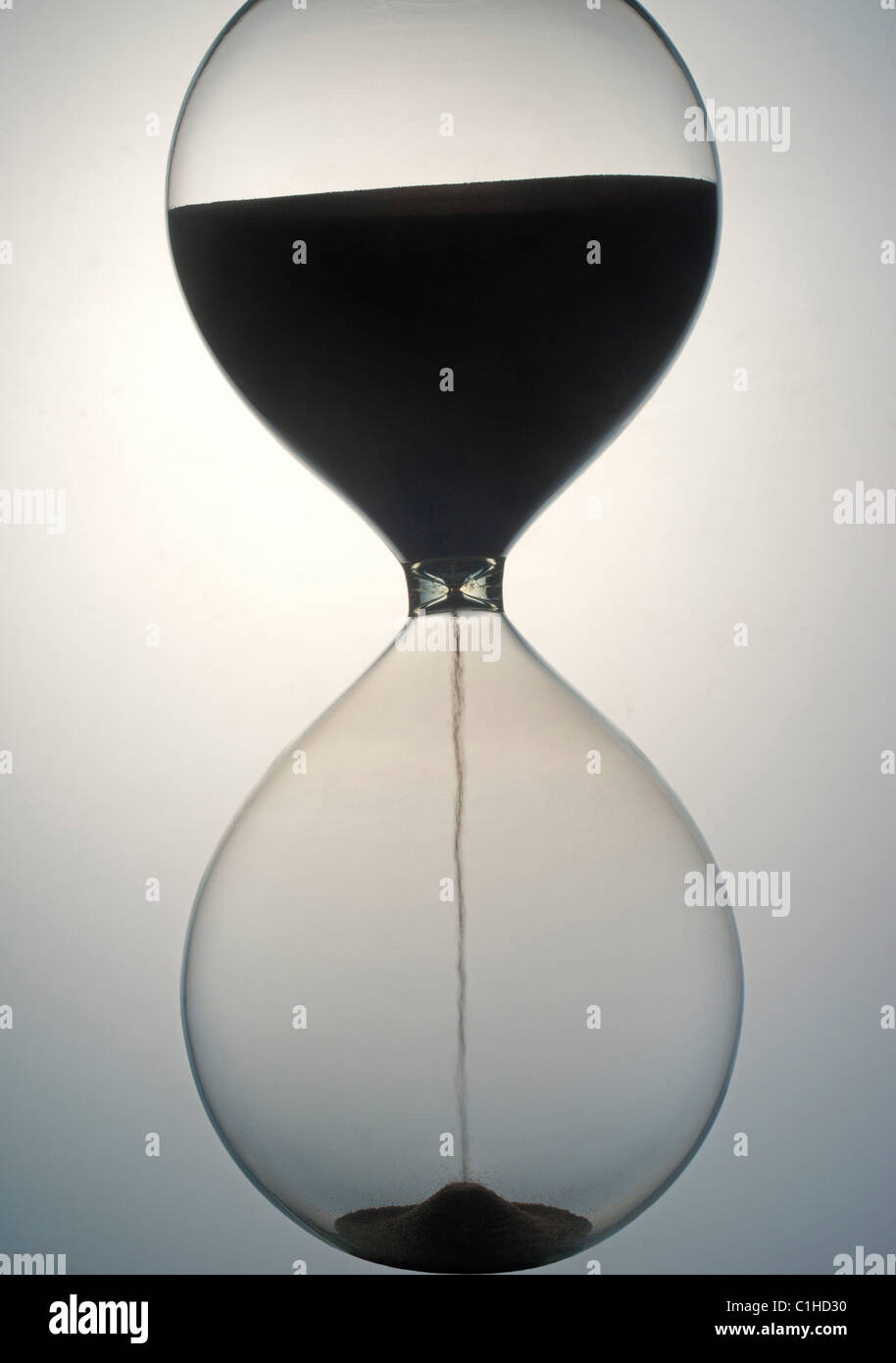 Hour glass with sand Stock Photo - Alamy