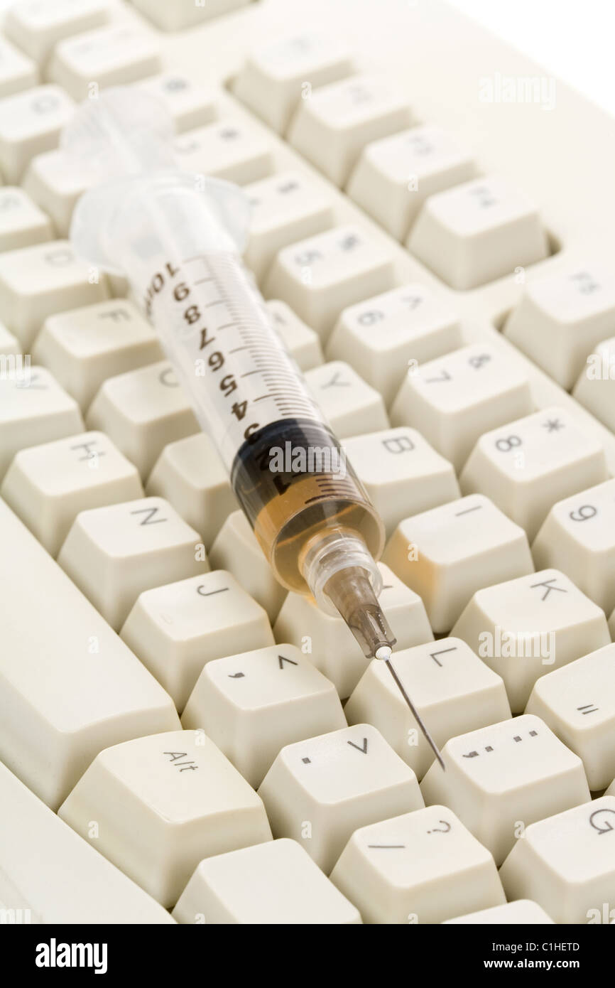 Syringe and keyboard close up shot, concept of computer virus Stock ...