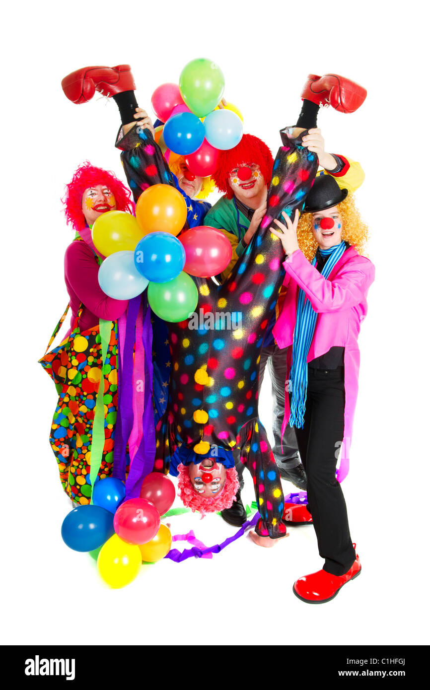 Happy clowns are having a celebration with balloons Stock Photo - Alamy