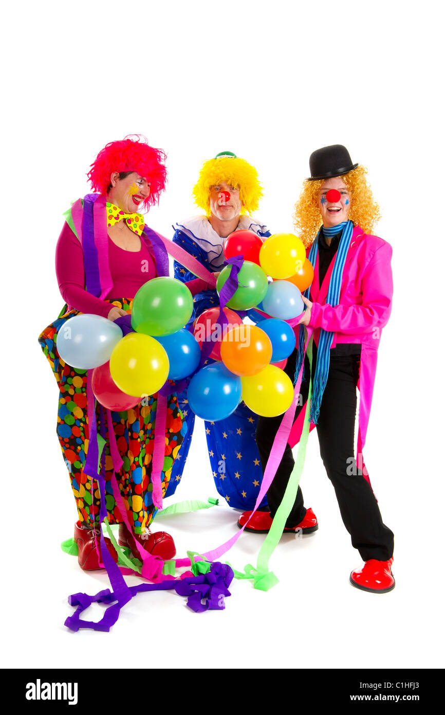 Happy clowns are having a celebration with balloons Stock Photo - Alamy