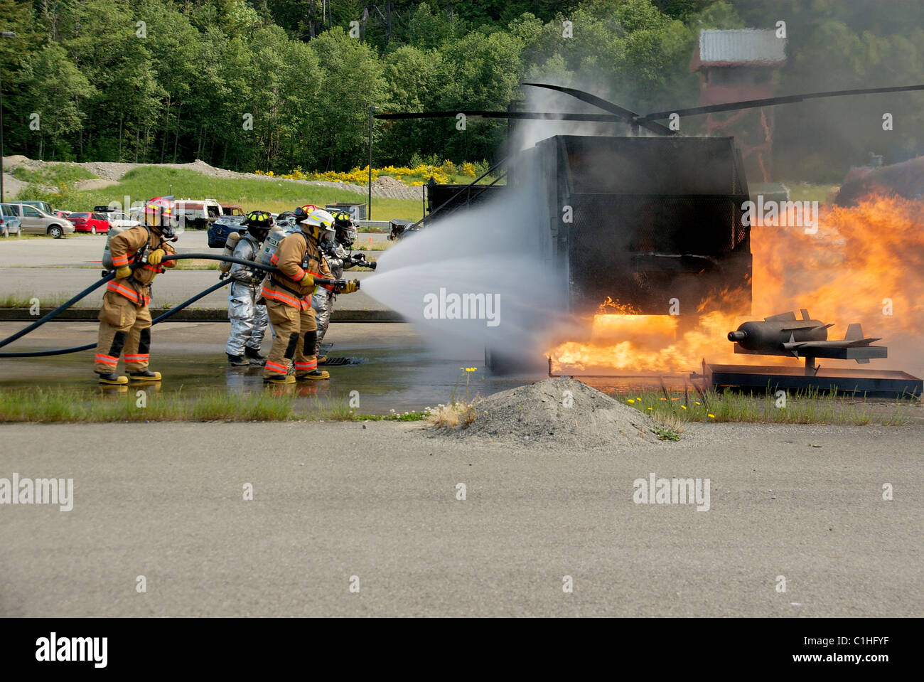 Firefighters fighting fire at an ARFF training drill at the Washington ...