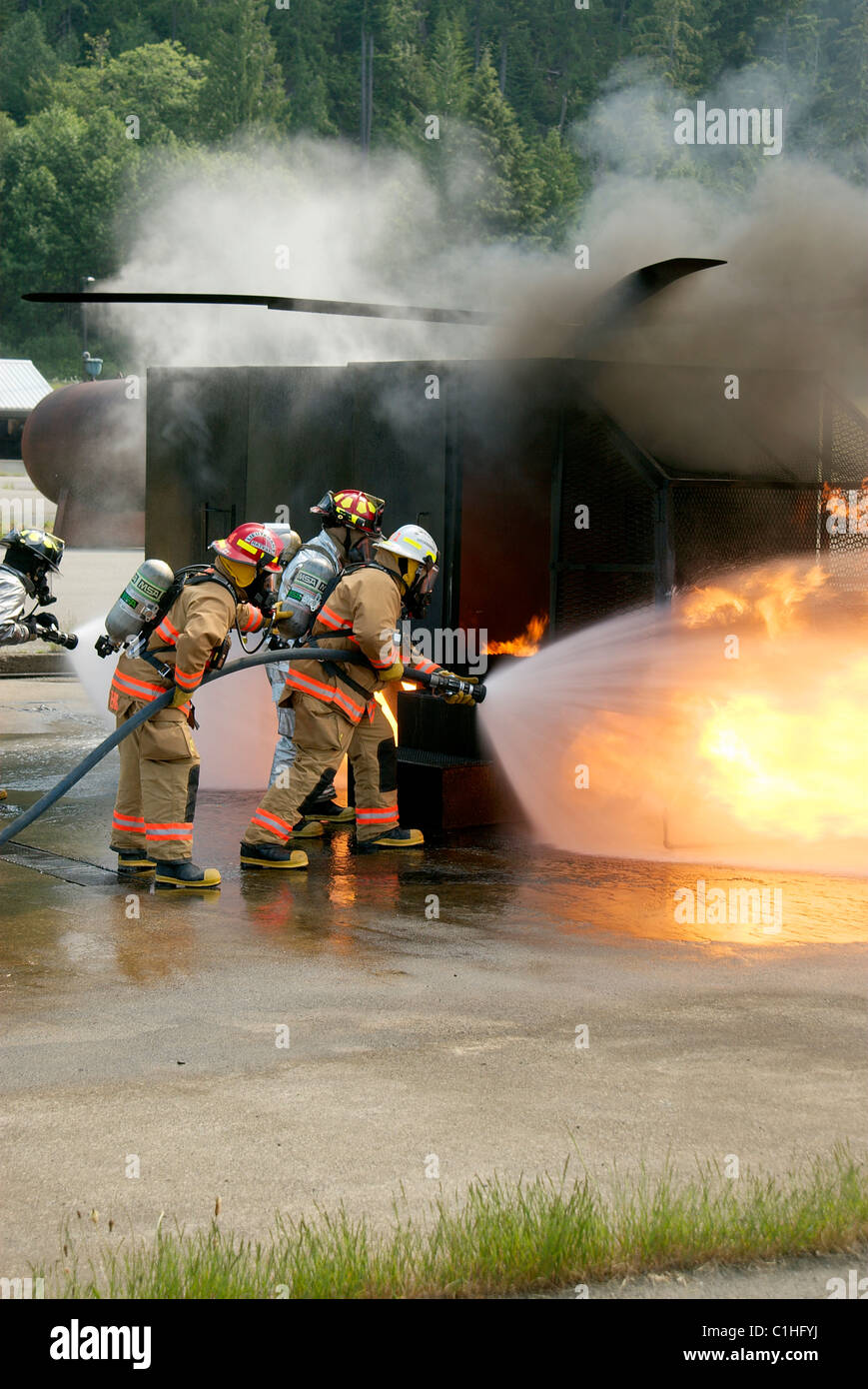 Firefighters fighting fire at an ARFF training drill at the Washington ...