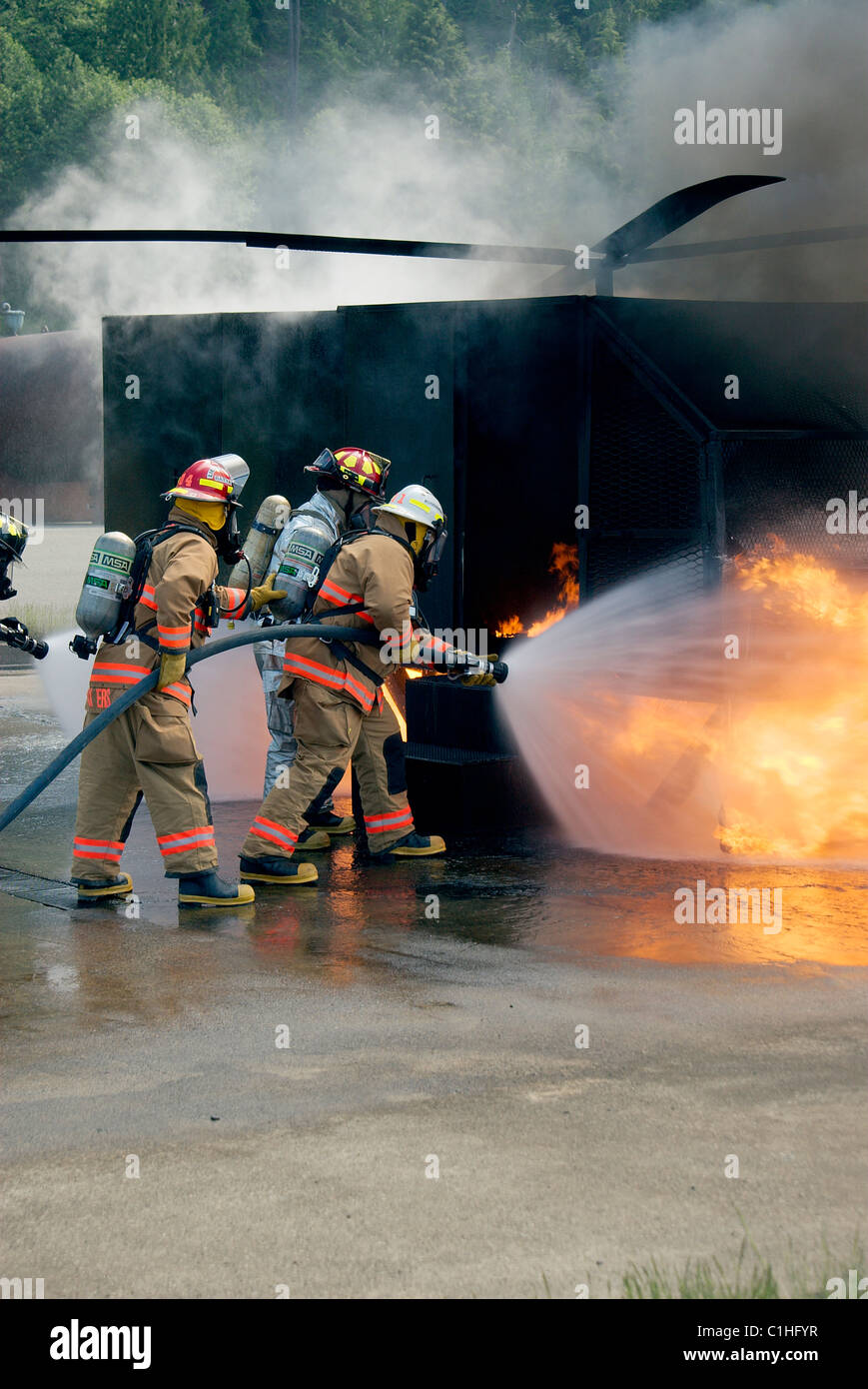 Firefighters fighting fire at an ARFF training drill at the Washington ...
