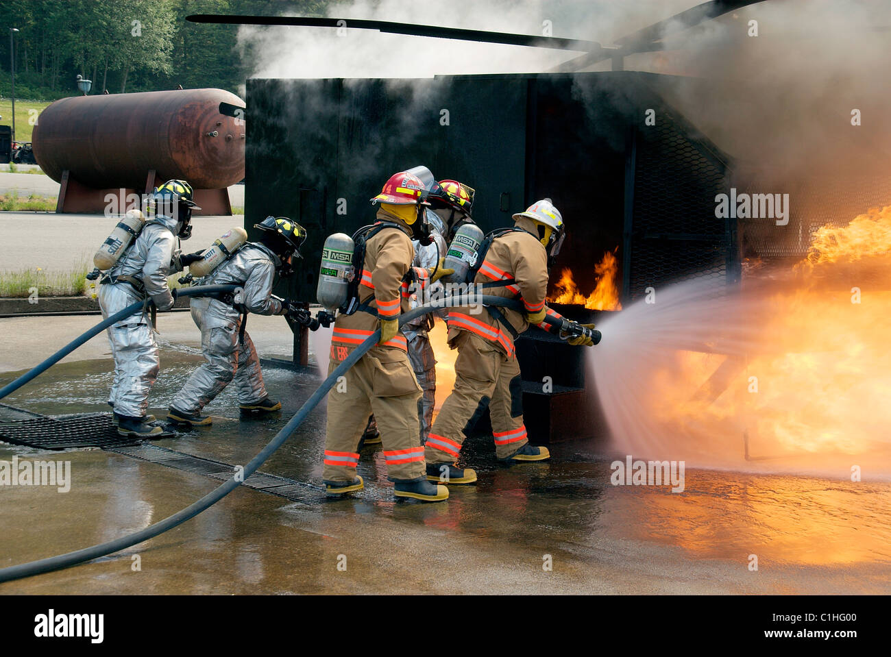 Firefighters fighting fire at an ARFF training drill at the Washington ...