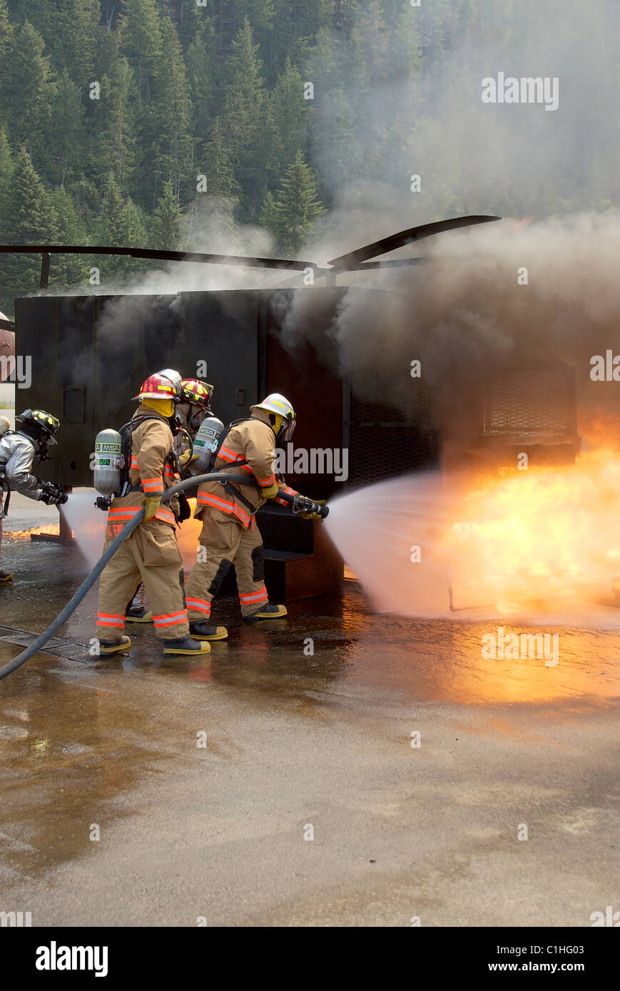Firefighters fighting fire arff training hi-res stock photography and ...