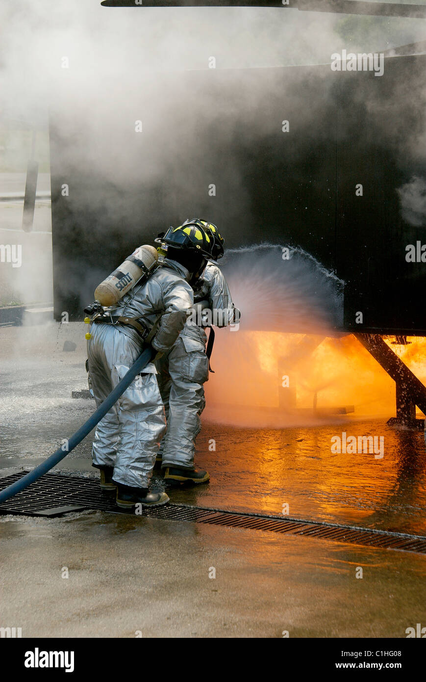 Firefighters fighting fire at an ARFF training drill at the Washington ...