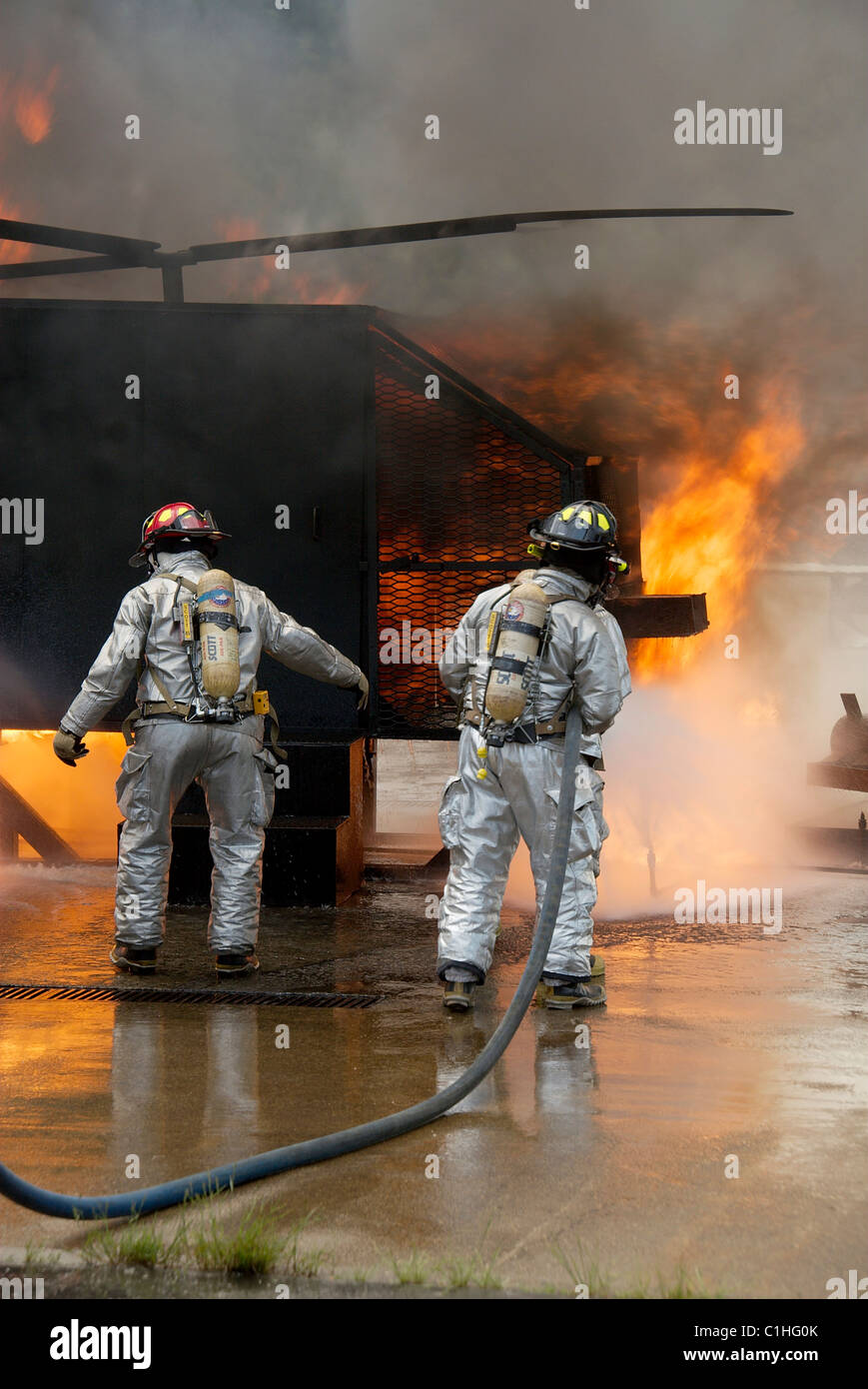 Firefighters fighting fire at an ARFF training drill at the Washington ...