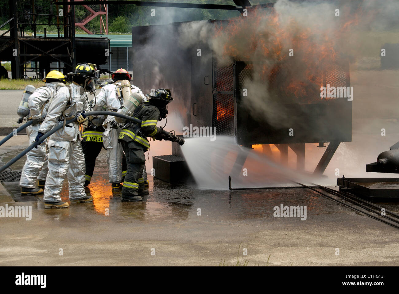 Firefighters fighting fire at an ARFF training drill at the Washington ...