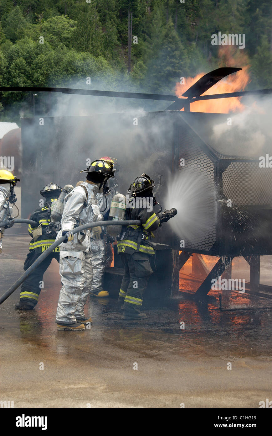 Firefighters fighting fire at an ARFF training drill at the Washington ...