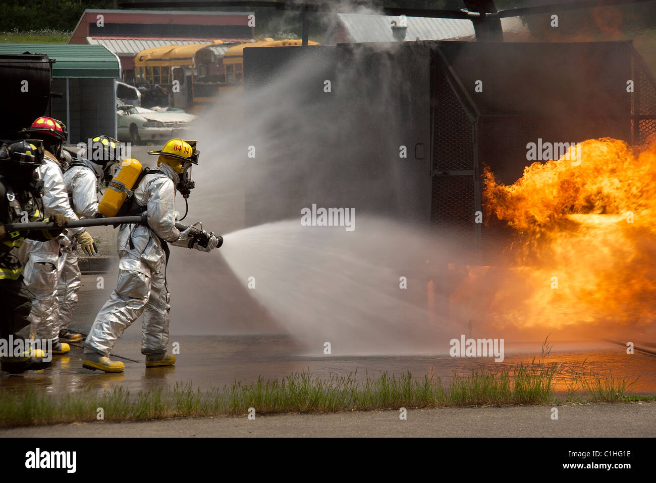 Firefighters fighting fire at an ARFF training drill at the Washington ...