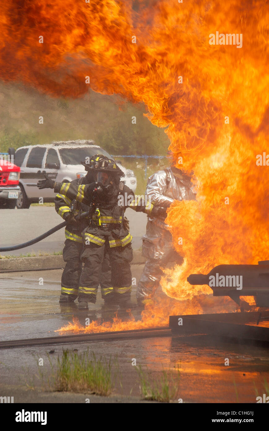 Firefighters fighting fire arff training hi-res stock photography and ...
