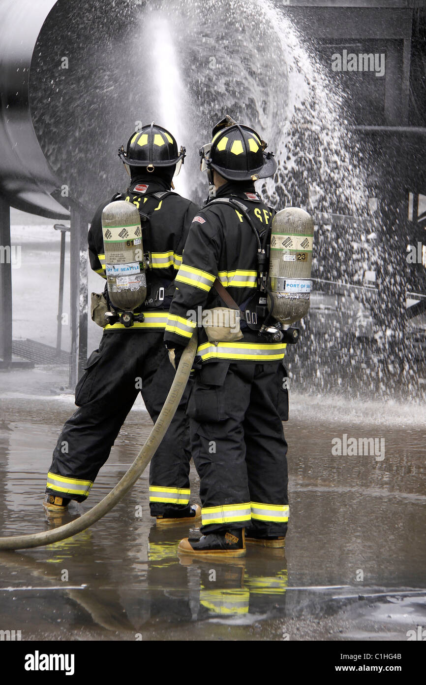 Firefighters fighting fire at an ARFF training drill at the Washington ...