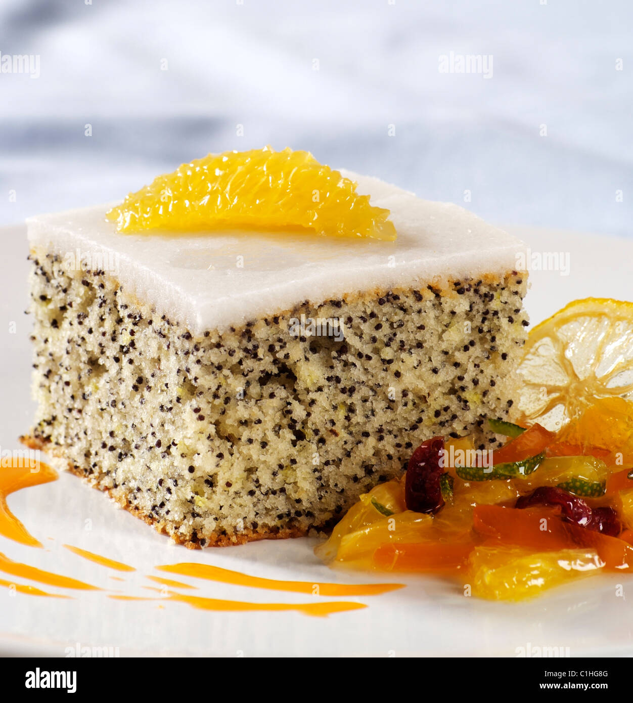 Piece of poppy seed cake with icing Stock Photo - Alamy