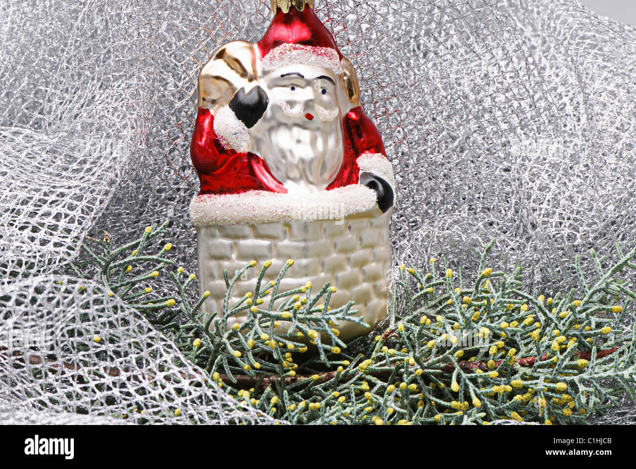 Christmas decoration, Santa Claus in chimney Stock Photo - Alamy