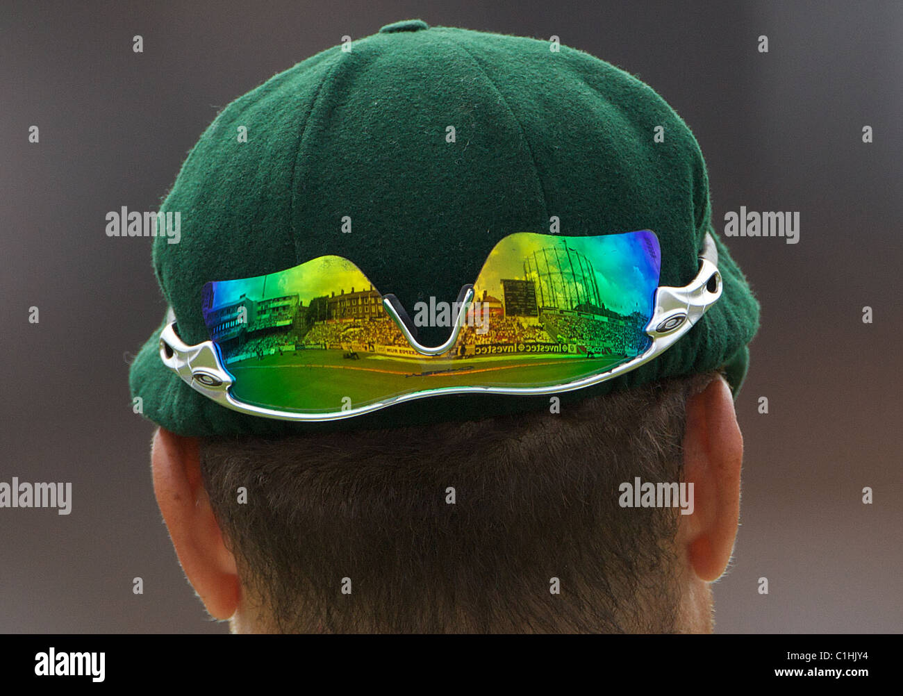 Stuart Clark fielding with the Oval reflected in his sun glasses during ...