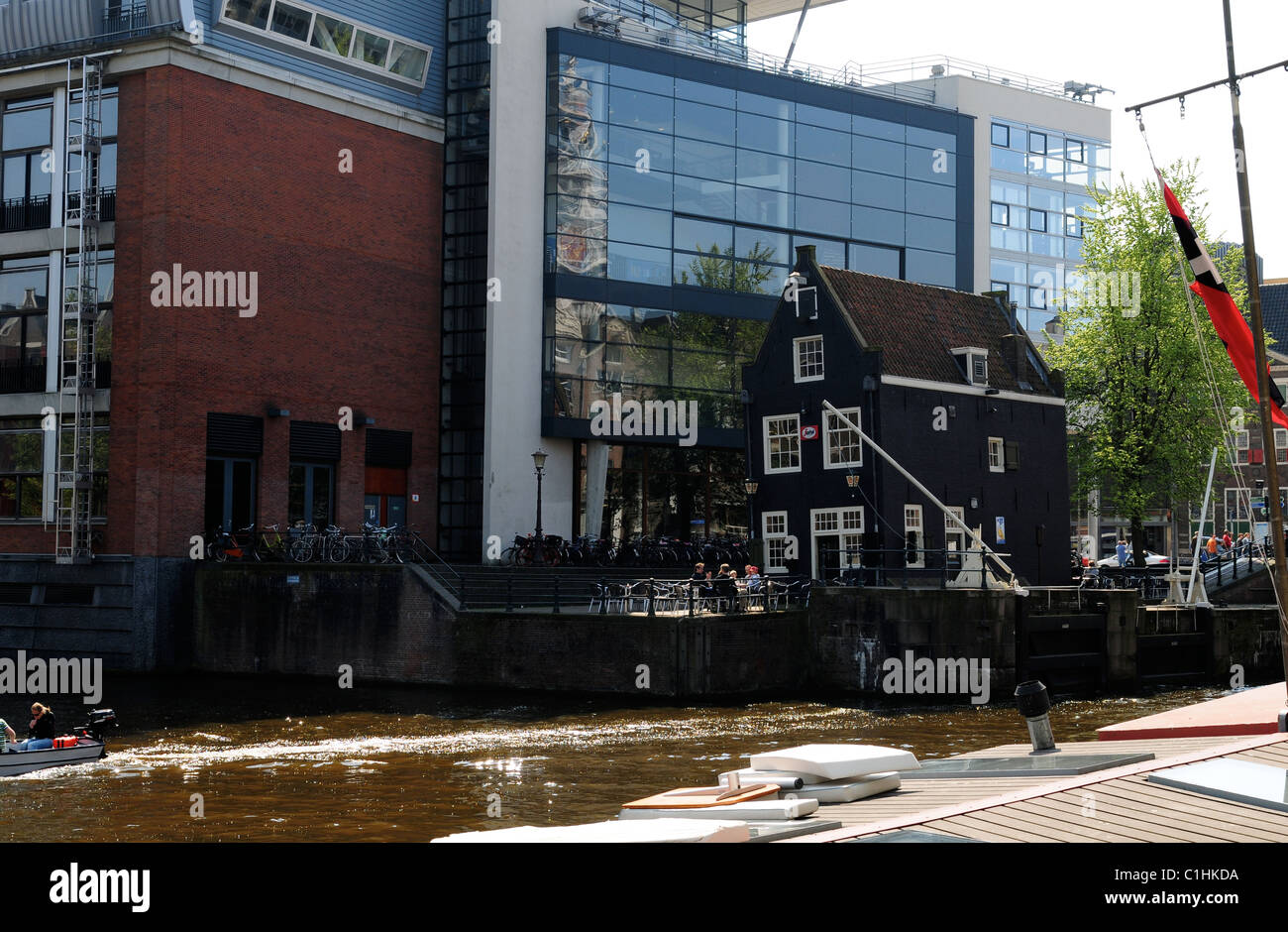 A canal view of a restaurant next to the canal raising bridge Stock ...