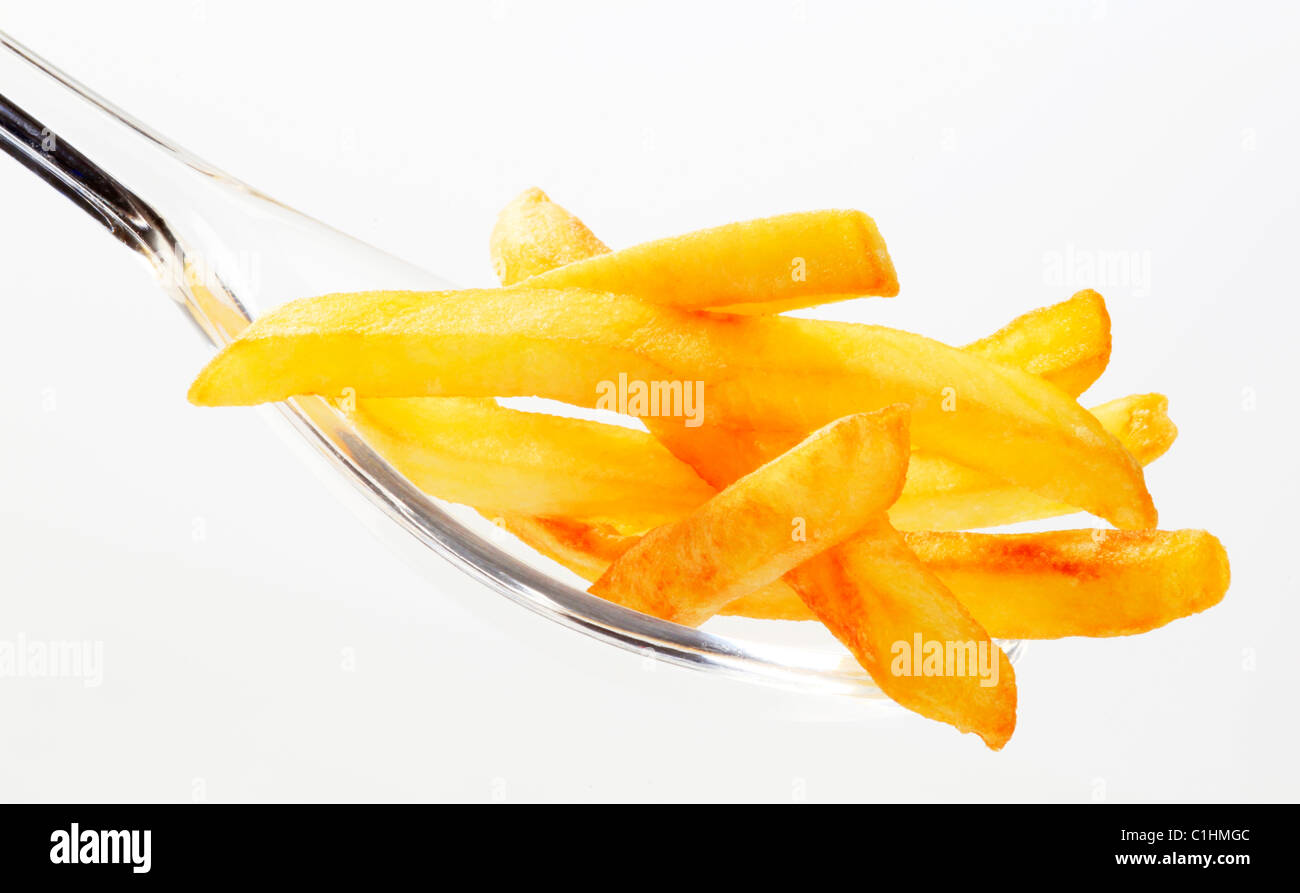 French fries on a plastic spoon - closeup Stock Photo - Alamy