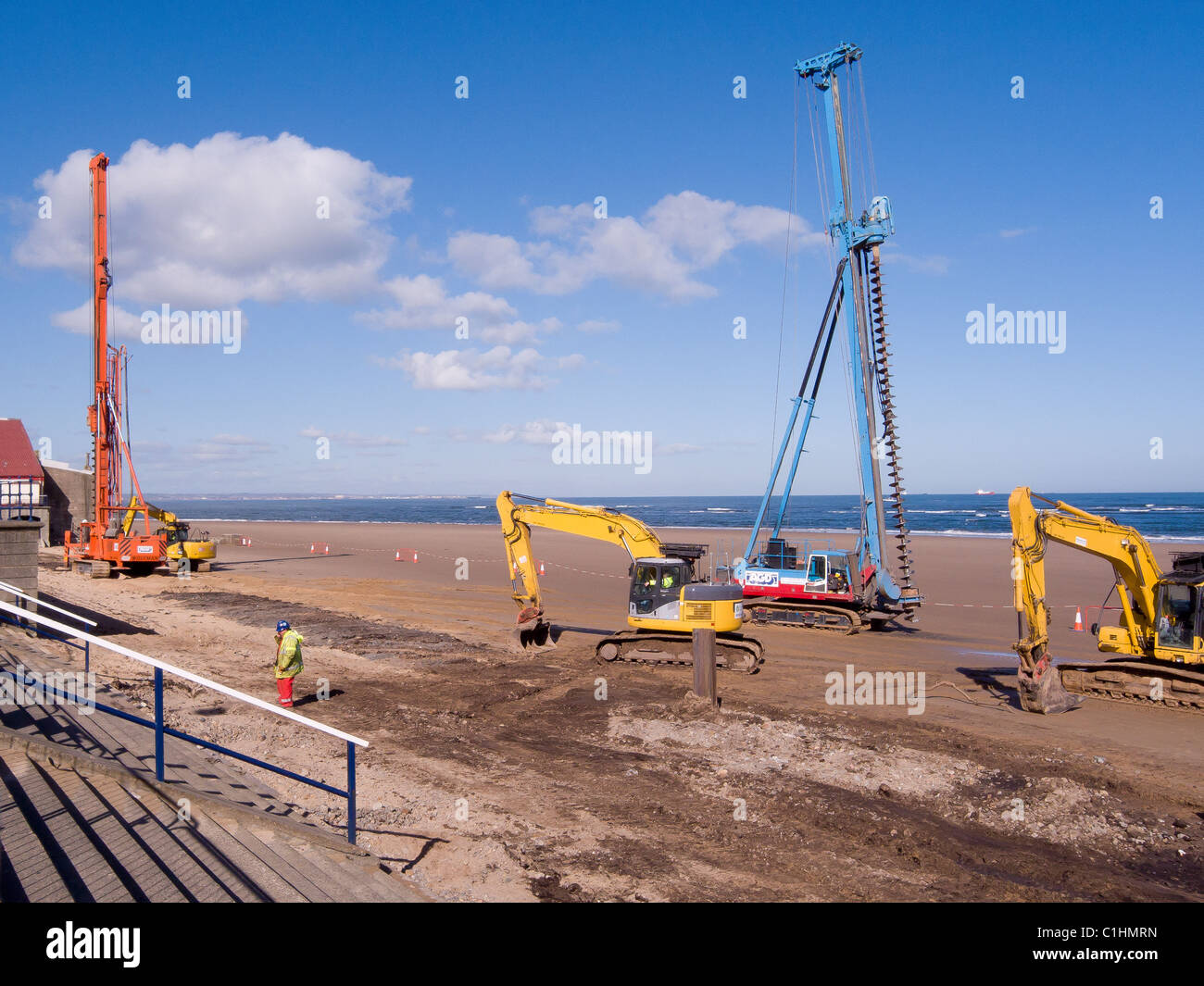 Construction plant for a new sea wall on the beach at Redcar Cleveland ...