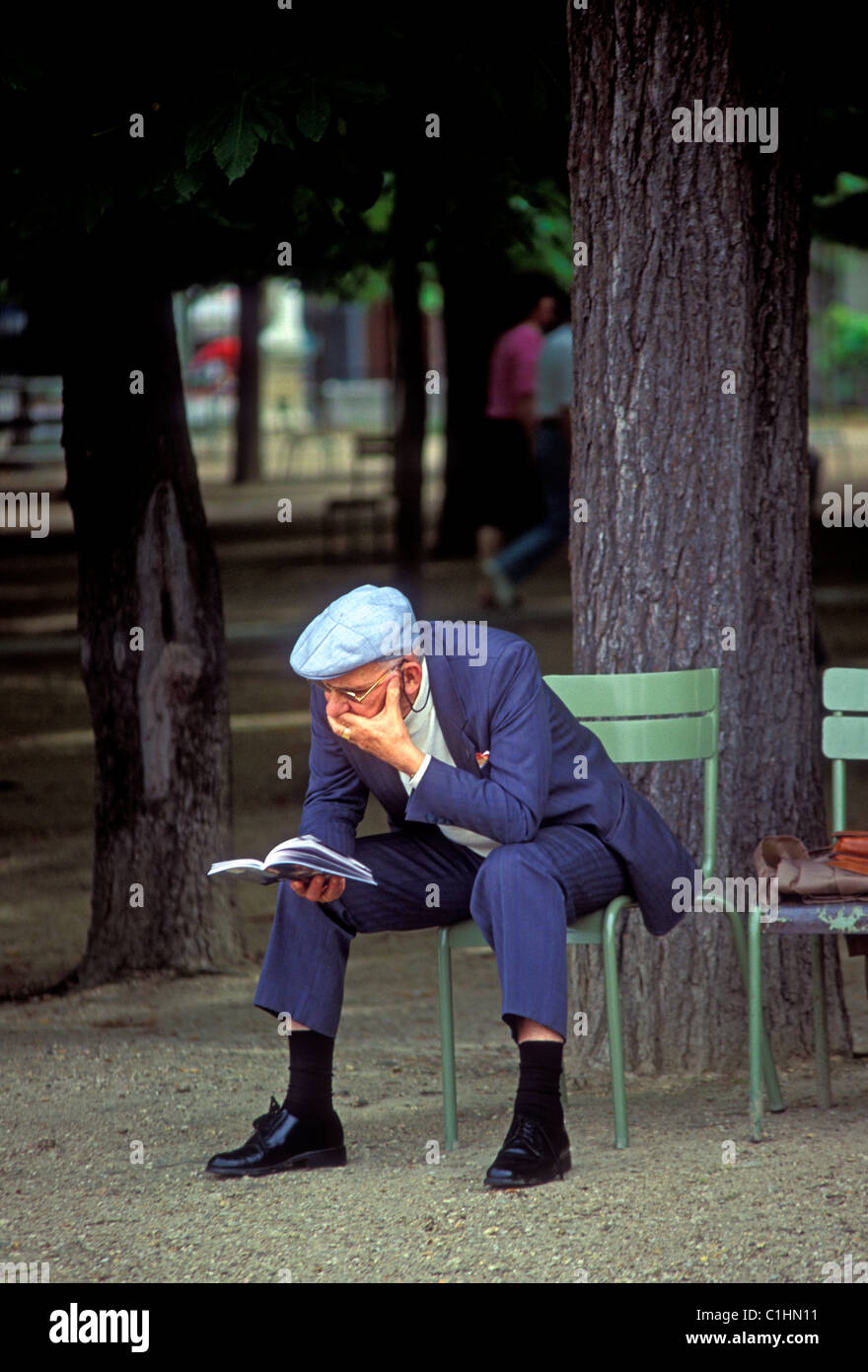 Frenchman, French man, adult man, elderly man, sitting on bench ...
