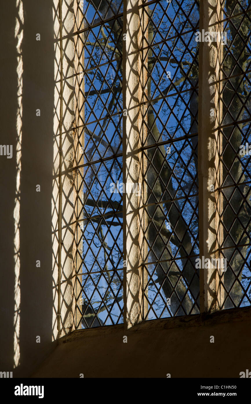 Close up of light and shadow detail of a lead lined window in St Marys ...