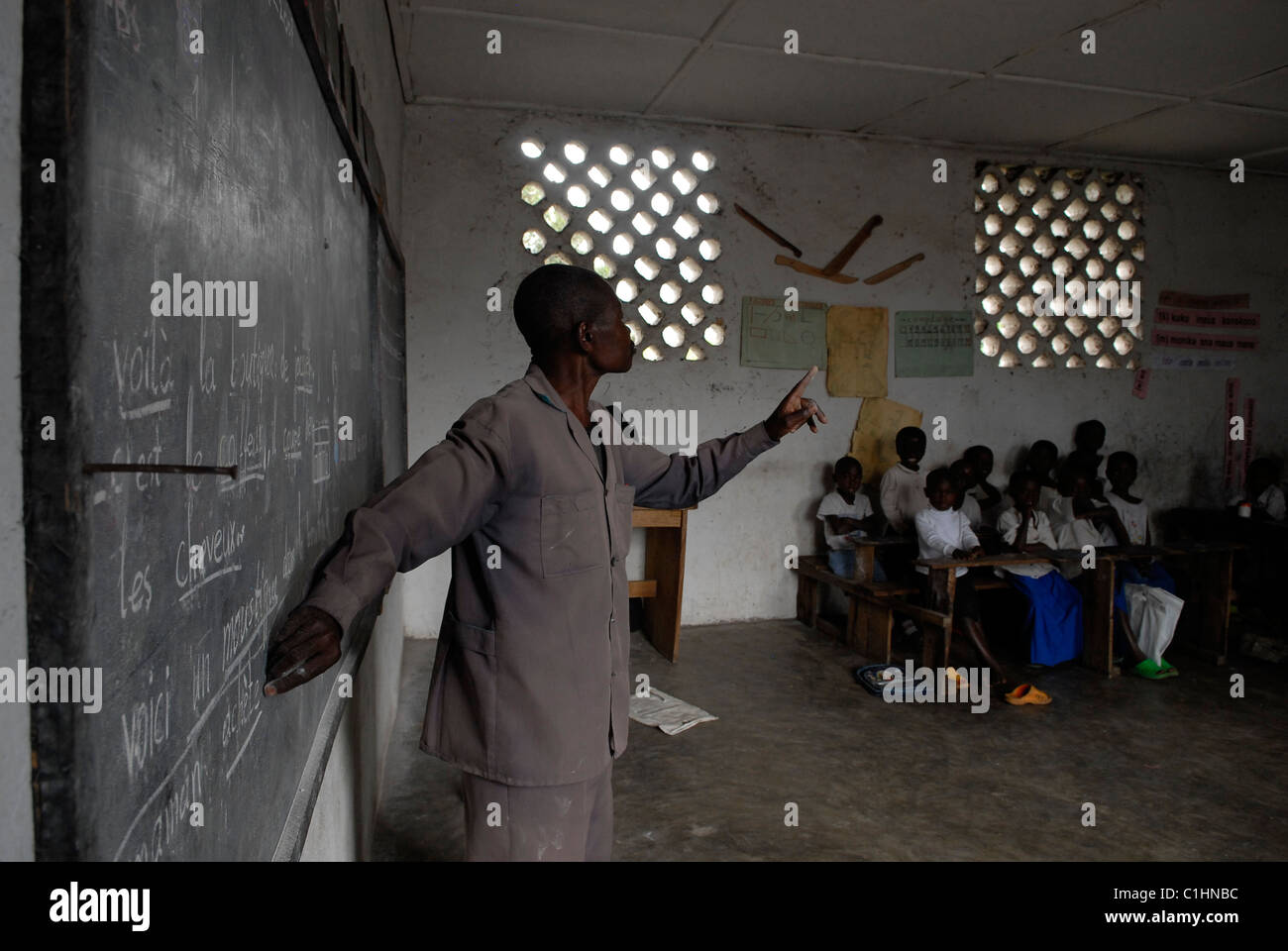 A teacher teaching French language in a primary classroom in North Kivu ...